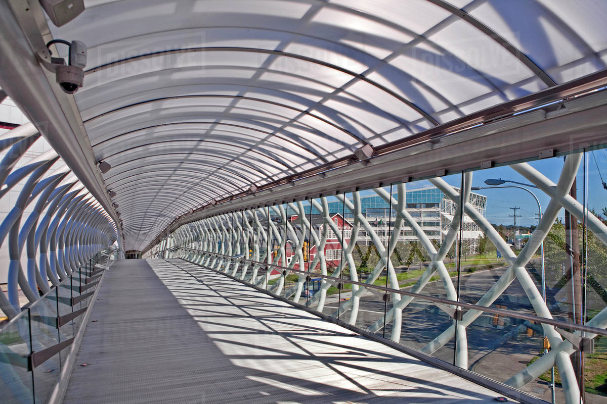 Tubular Sky Bridge Crossing Over Road - Royalty-free Stock Photo | Dissolve