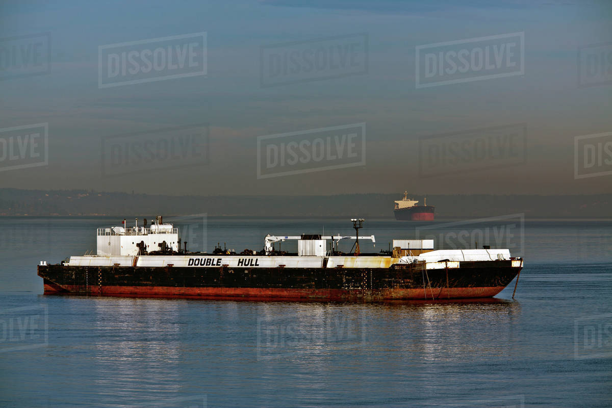 Shipping Vessel Floating in Water - Royalty-free Stock Photo | Dissolve