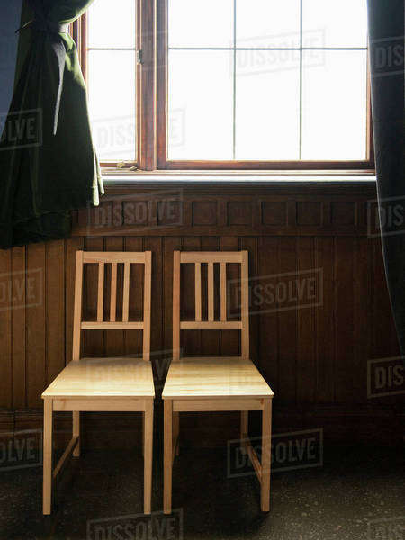 Two Empty Chairs Beneath a Window - Royalty-free Stock Photo | Dissolve