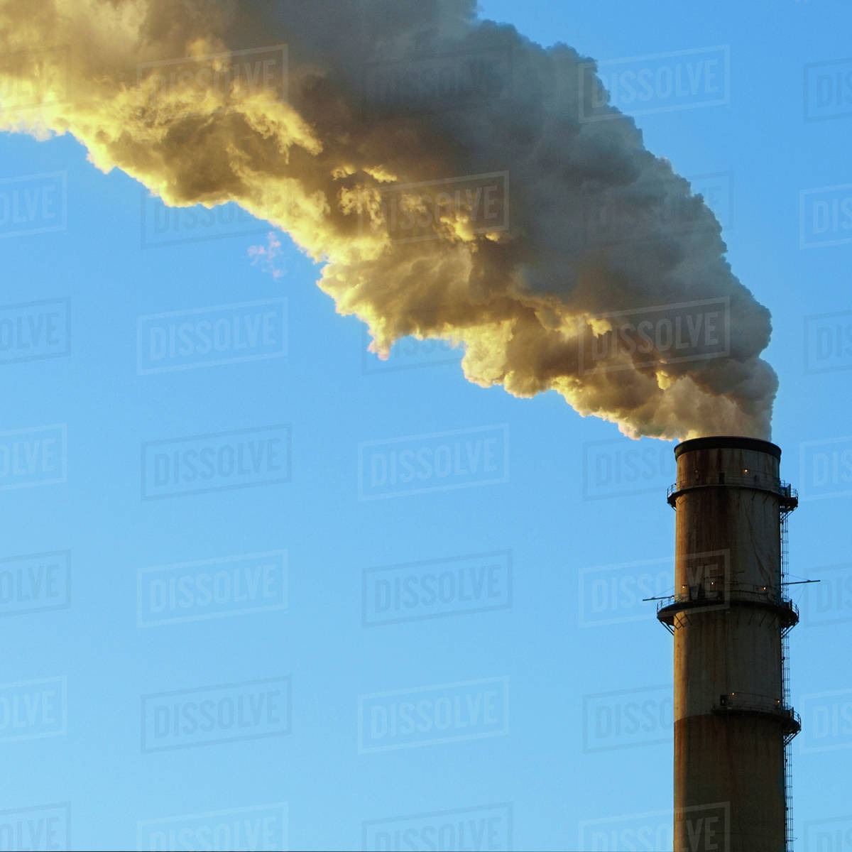 Smoke emitting from factory smoke stack - Stock Photo - Dissolve