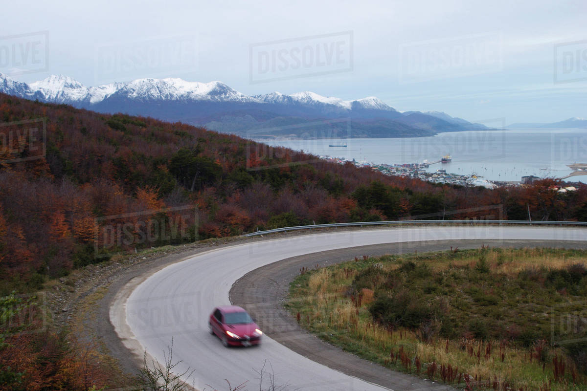 Car Driving On Curved Road - Royalty-free Stock Photo | Dissolve