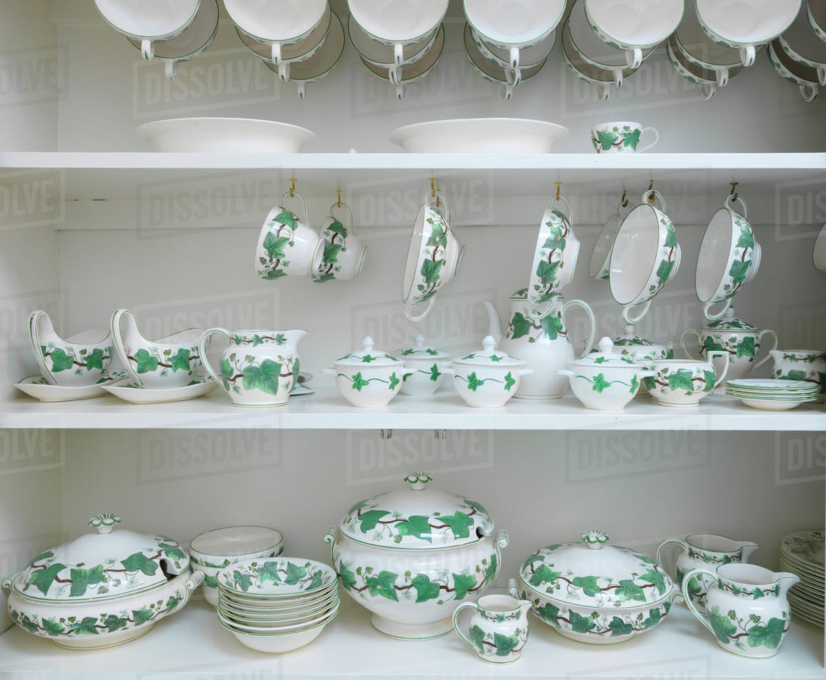 Matching ceramic dinnerware on shelves - Royalty-free Stock Photo ...