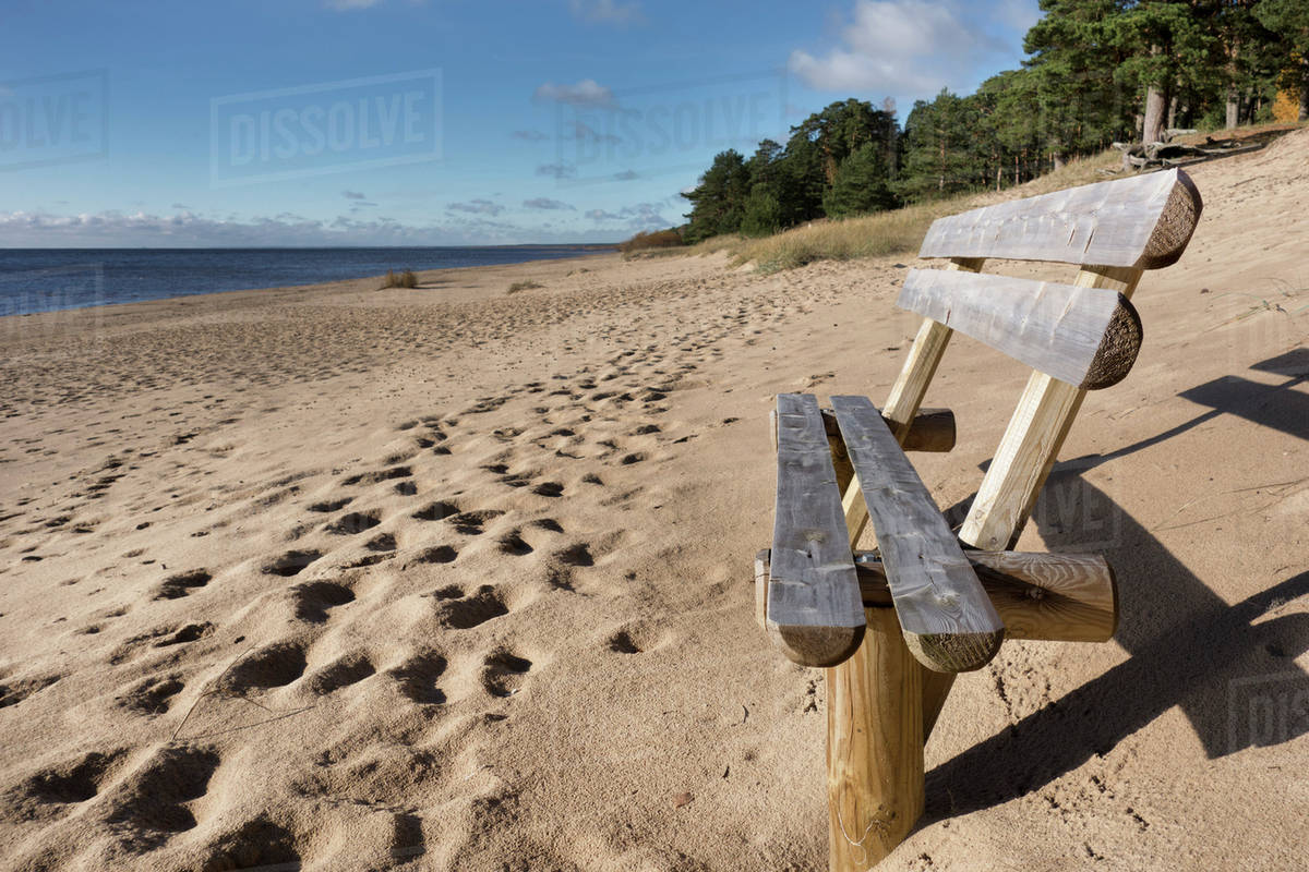 A wooden bench on Kauksi beach - Stock Photo - Dissolve