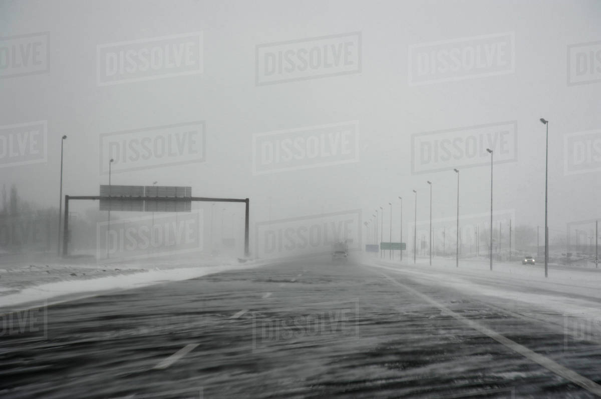 Snow blowing across highway - Royalty-free Stock Photo | Dissolve
