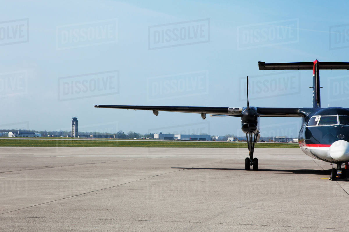 Airplane taxiing on runway - Royalty-free Stock Photo | Dissolve