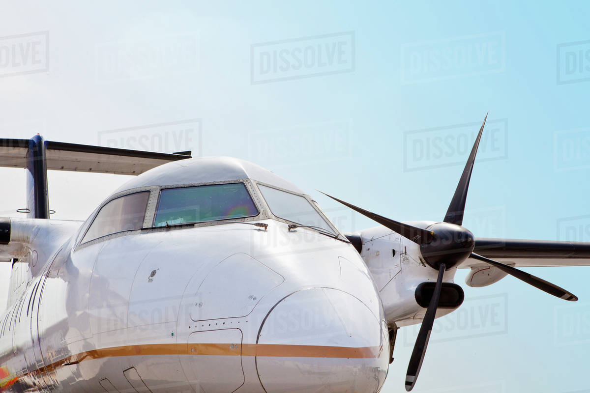 Close up of airplane on runway - Stock Photo - Dissolve