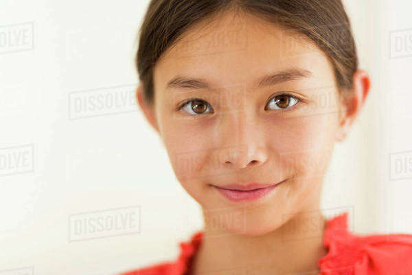 Mixed race girl smiling - Royalty-free Stock Photo | Dissolve