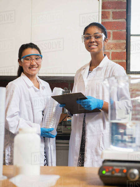 Students smiling in science lab - Royalty-free Stock Photo | Dissolve