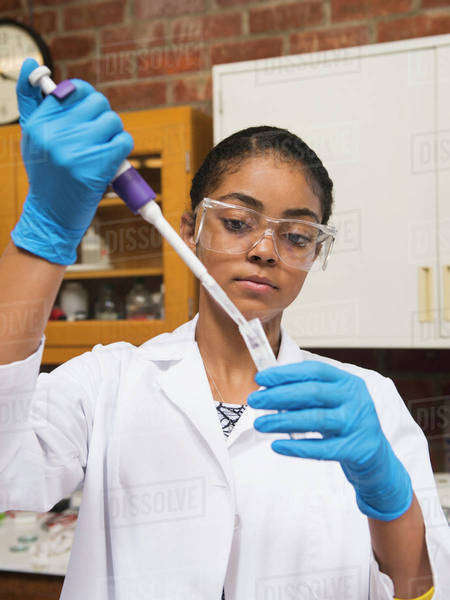Black student working in science lab - Royalty-free Stock Photo | Dissolve