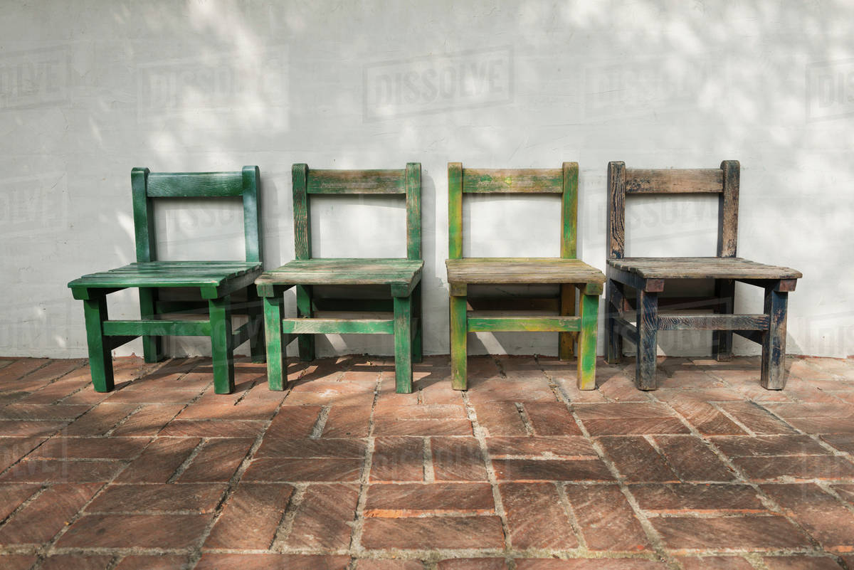 Empty wooden chairs outdoors - Royalty-free Stock Photo | Dissolve