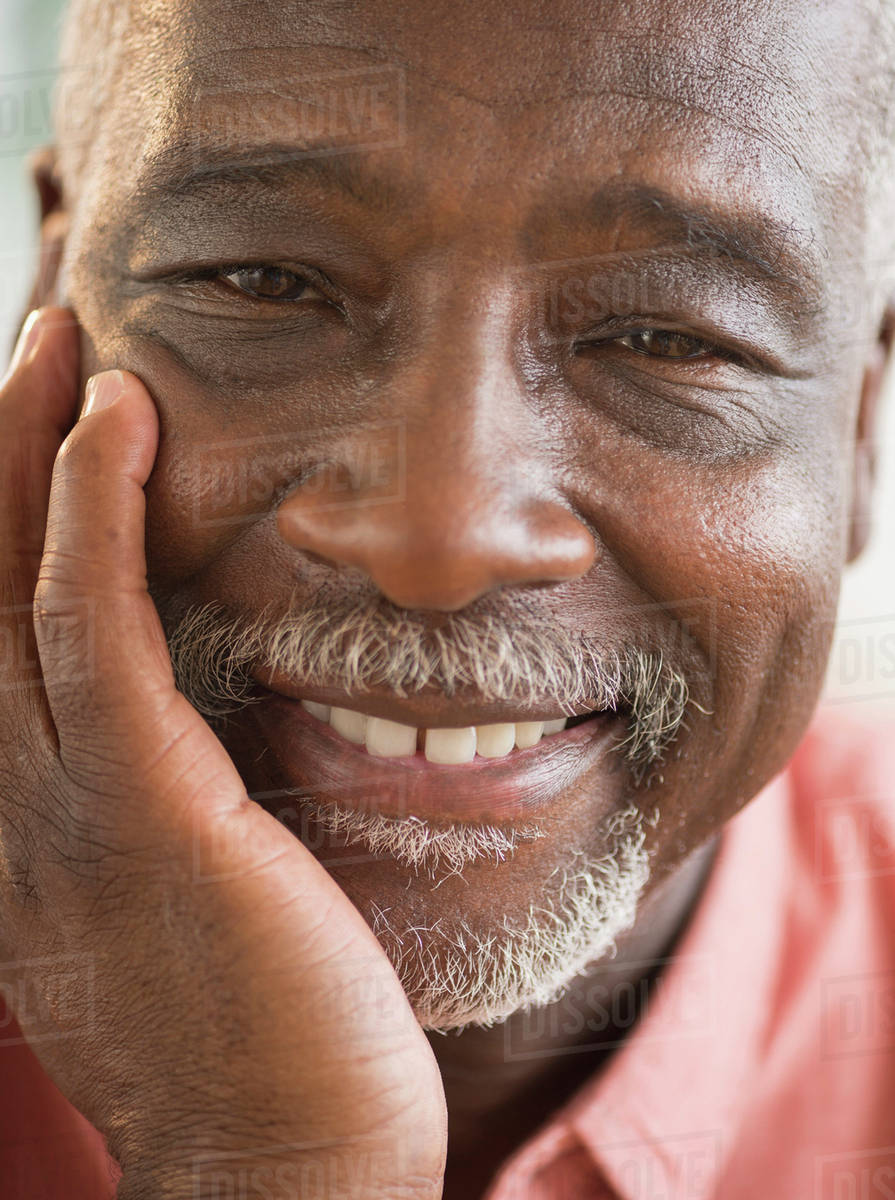 Black man smiling - Royalty-free Stock Photo | Dissolve