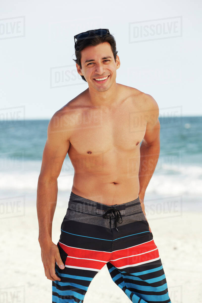 Man smiling on beach - Royalty-free Stock Photo | Dissolve