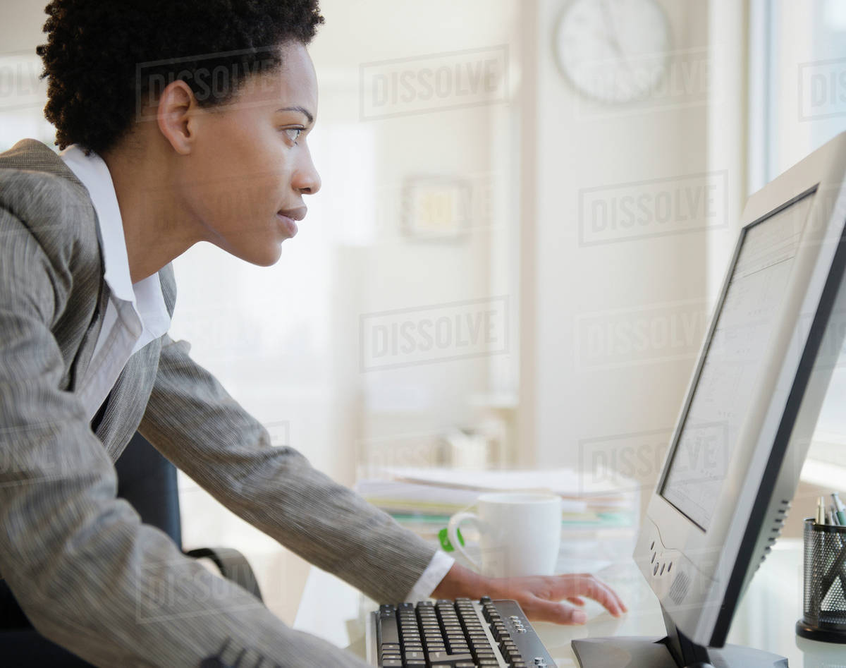 African American woman using computer - Royalty-free Stock Photo | Dissolve