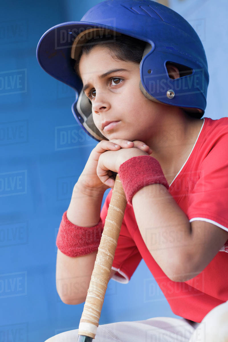 Sad Hispanic baseball player - Royalty-free Stock Photo | Dissolve