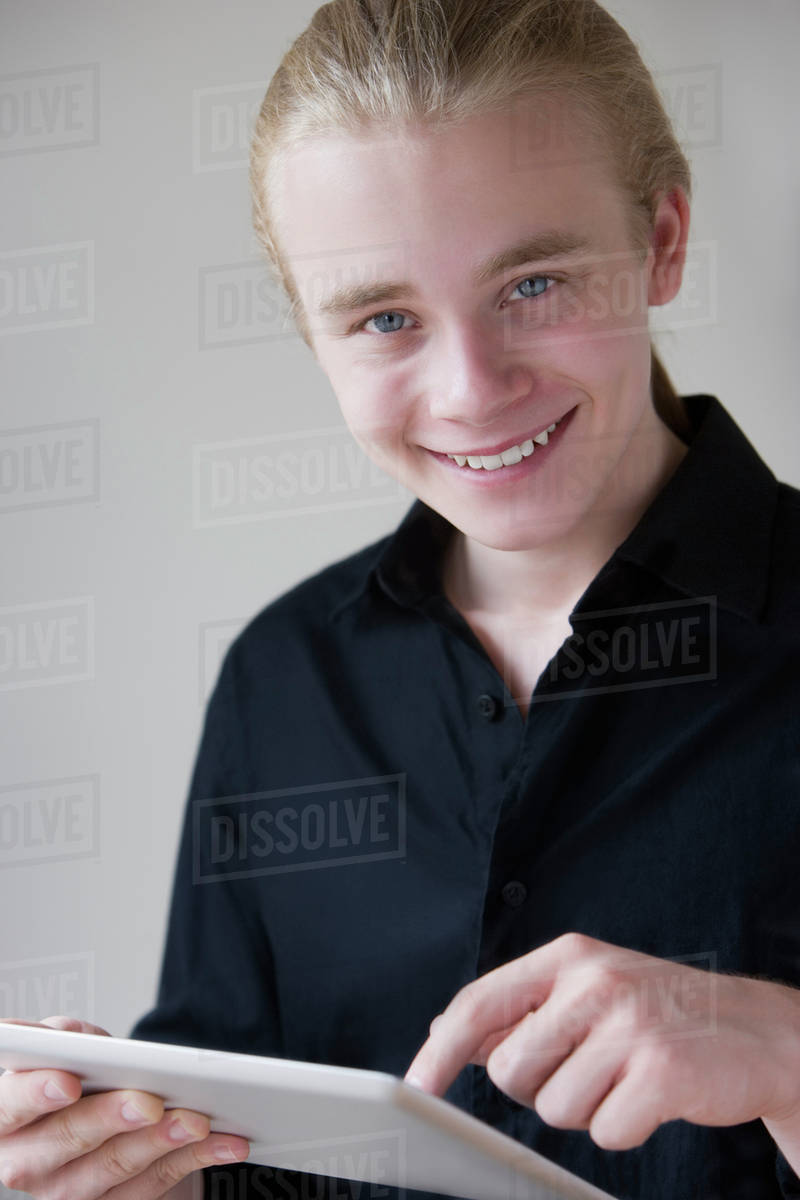 Caucasian teenage boy using digital tablet - Royalty-free Stock Photo ...