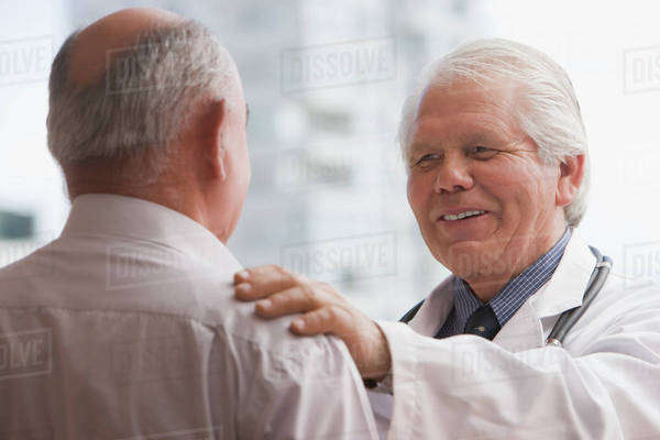 Chilean doctor talking to patient - Stock Photo - Dissolve