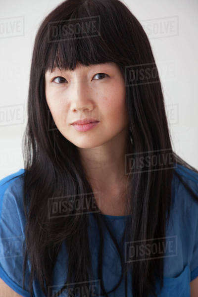 Chinese woman with serious face - Royalty-free Stock Photo | Dissolve