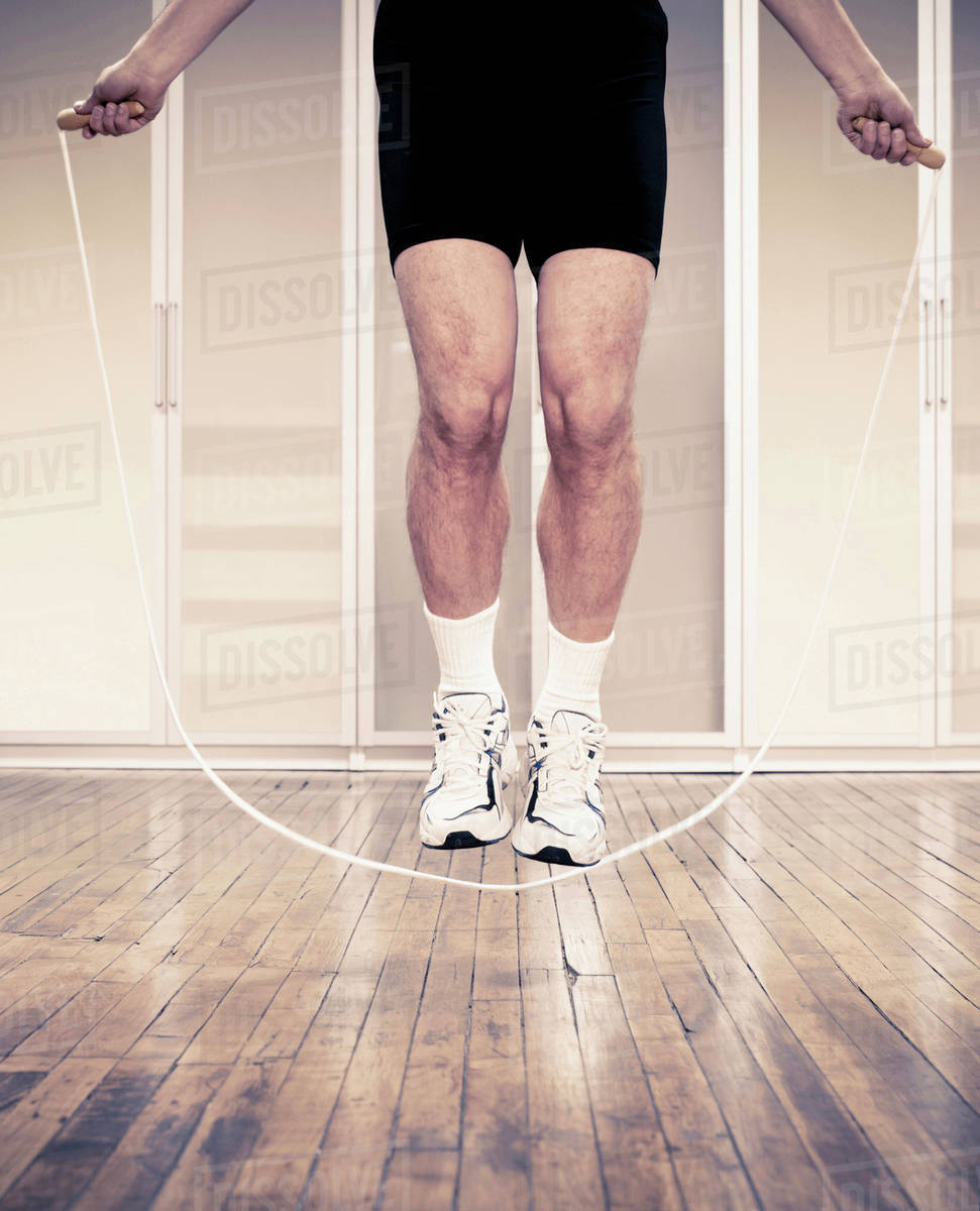 Man jumping rope indoors - Royalty-free Stock Photo | Dissolve