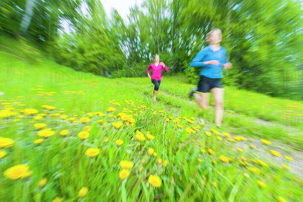 Blurred view of Caucasian women running on path - Royalty-free Stock ...