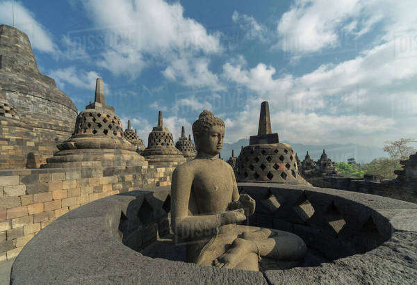 Buddha statue on Temple of Borobudur, Borobudur, Indonesia - Royalty ...