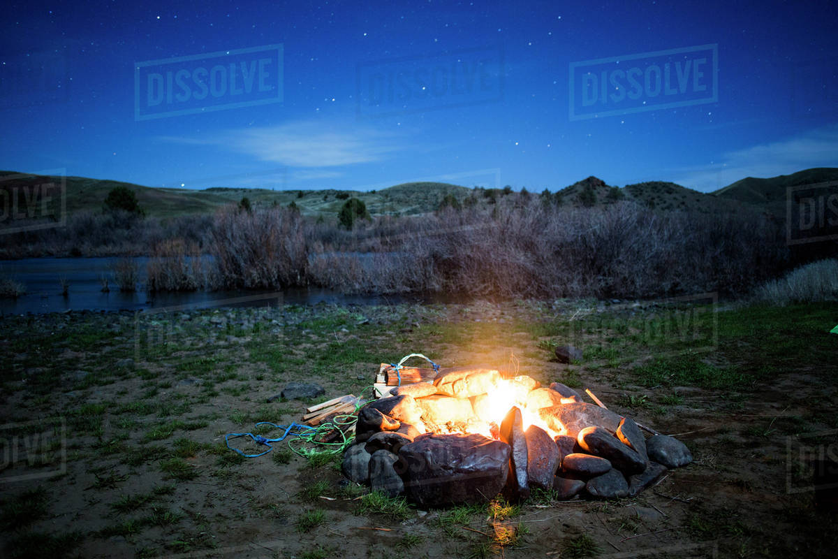Burning campfire in remote field, Painted Hills, Oregon, United States ...
