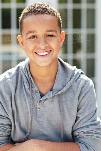 Close up of mixed race boy smiling outdoors - Royalty-free Stock Photo ...