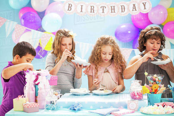 Children eating cake at birthday party - Royalty-free Stock Photo ...