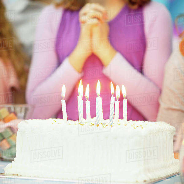 Close up of candles on birthday cake at party - Royalty-free Stock ...