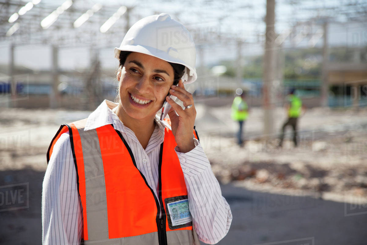 Architect talking on cell phone at construction site - Royalty-free ...