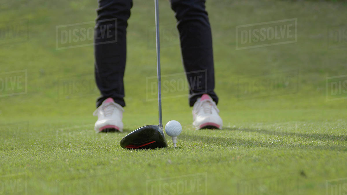 Caucasian woman teeing off on golf course - Royalty-free Stock Photo ...