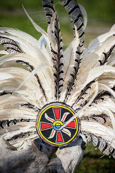 Traditional headdress on wooden log - Royalty-free Stock Photo | Dissolve