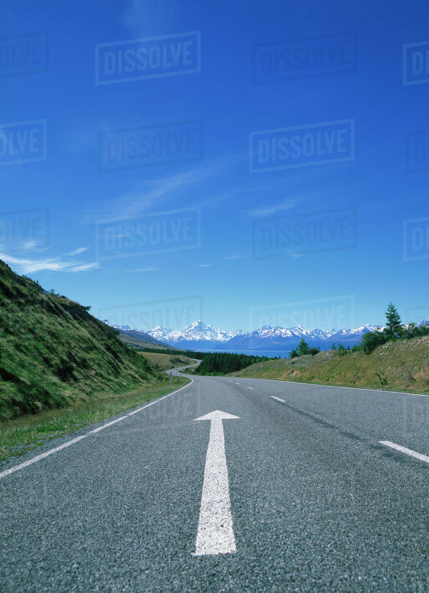 Directional arrow on empty remote road - Royalty-free Stock Photo ...