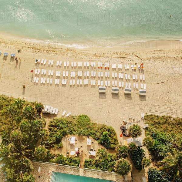 Aerial view of hotel pool and tropical beach - Royalty-free Stock Photo ...