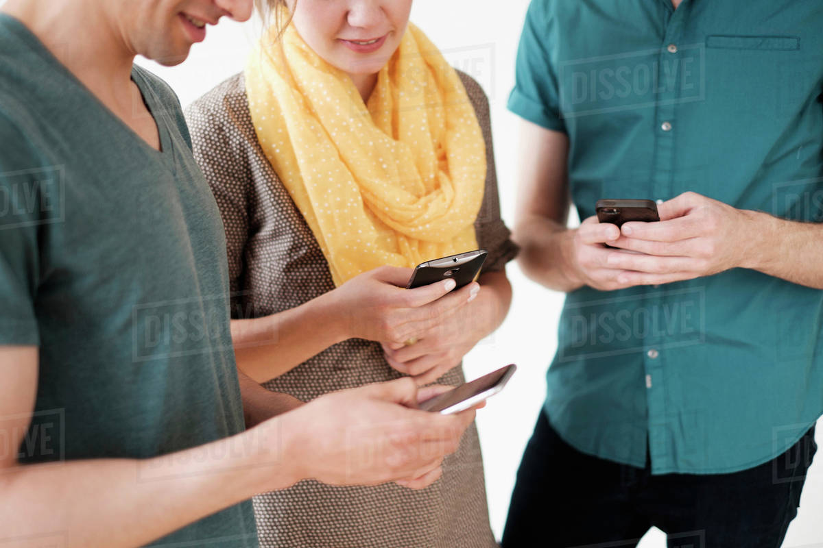 People using cell phones - Royalty-free Stock Photo | Dissolve