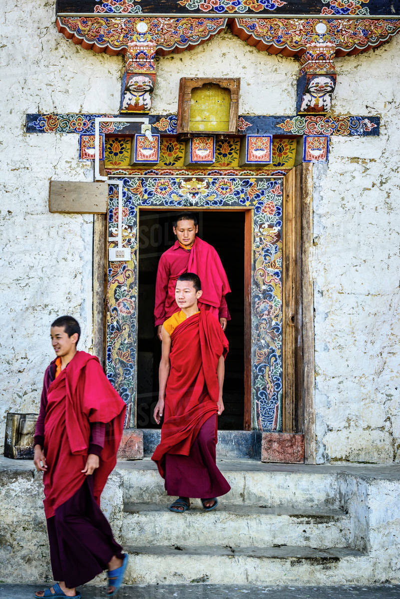 Asian monks walking out temple doorway - Royalty-free Stock Photo ...