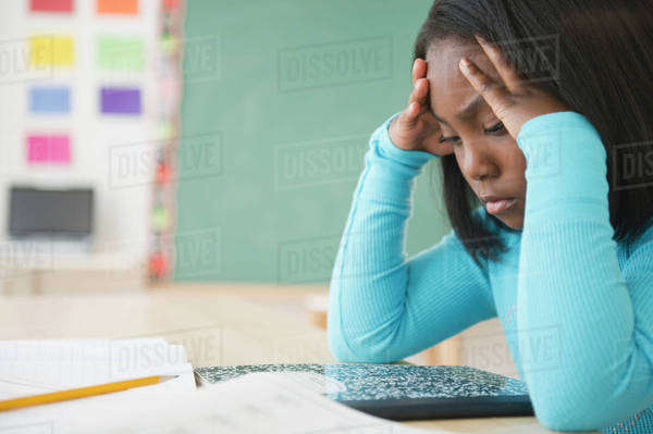 Black student studying in classroom - Royalty-free Stock Photo | Dissolve