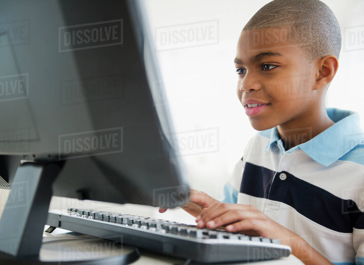 African American boy using computer - Royalty-free Stock Photo | Dissolve