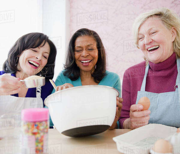 Friends baking together - Royalty-free Stock Photo | Dissolve