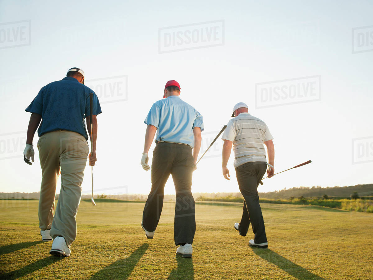 Golfers walking together on golf course - Royalty-free Stock Photo ...