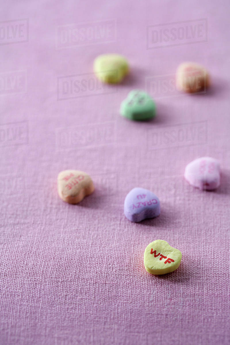 Valentine candy heart with the letters "wtf" on it - Stock Photo - Dissolve