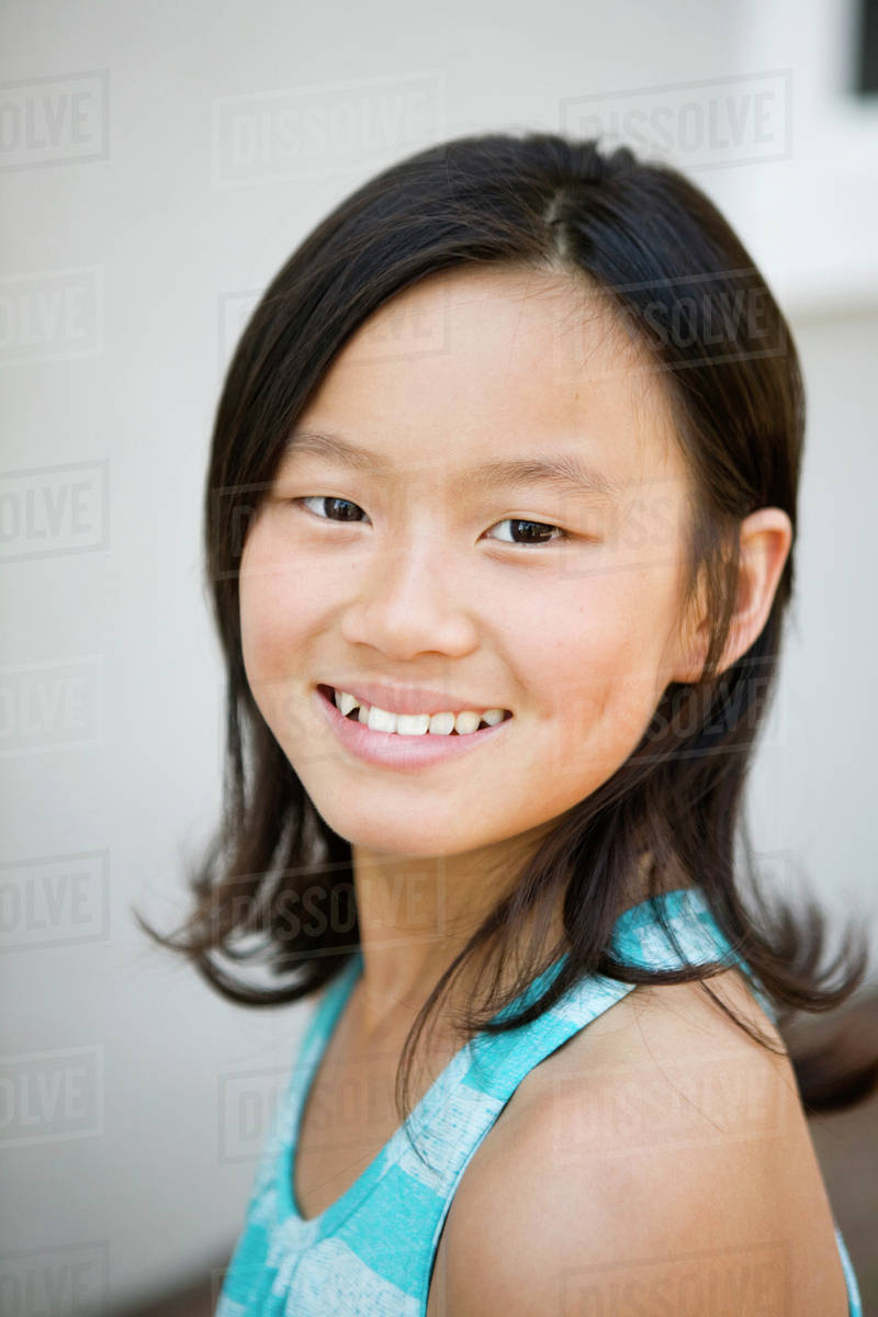 Smiling Chinese girl - Royalty-free Stock Photo | Dissolve