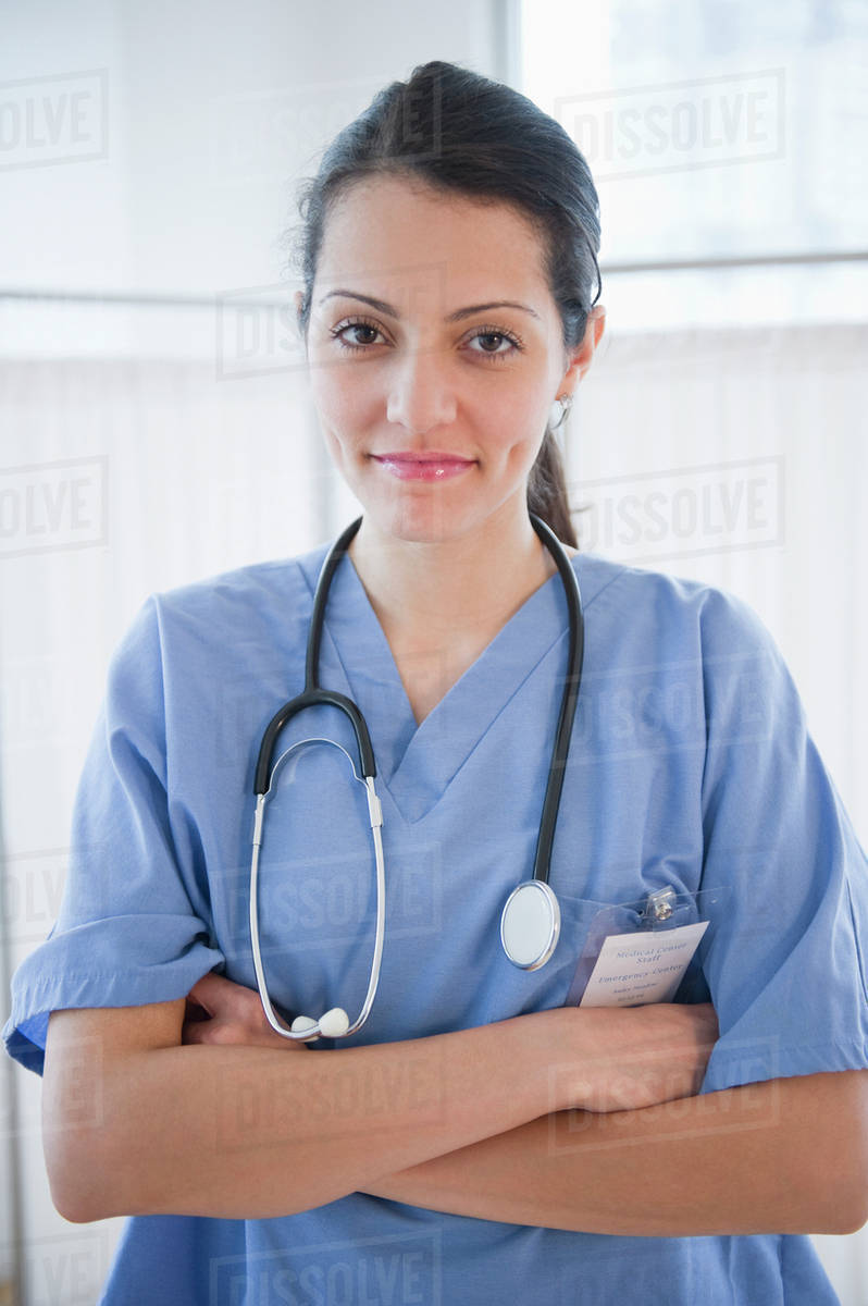 Brazilian doctor with arms crossed - Stock Photo - Dissolve