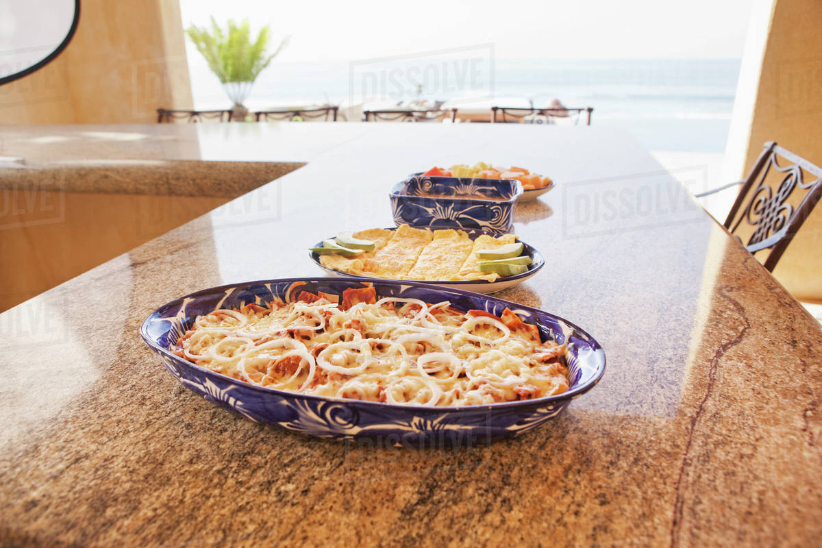 Plates of fresh food on bar - Royalty-free Stock Photo | Dissolve