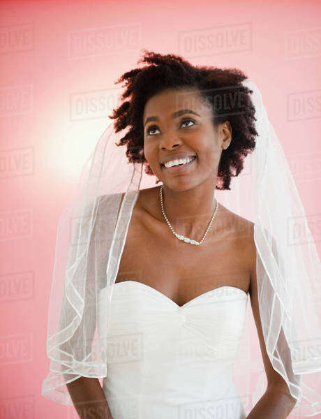 Smiling Black bride in wedding dress - Royalty-free Stock Photo | Dissolve