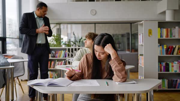 Asian teenage girl student reasoning over the control card with ...