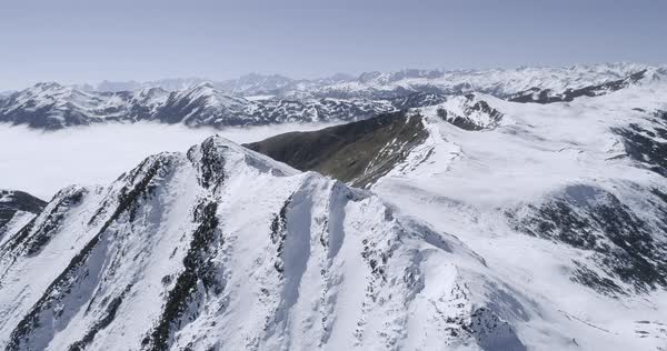 4k Aerial view of snow mountain range landscape drone flying over ...