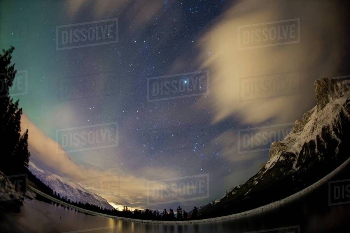 Fish eye view of sky and lake, mountains, sunset - Stock Photo - Dissolve