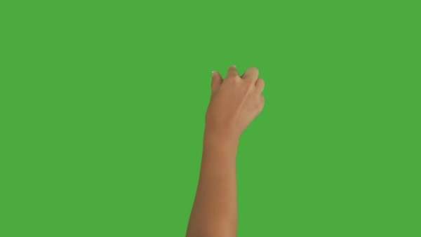 Isolated shot of a female hand on a green screen doing touch screen ...