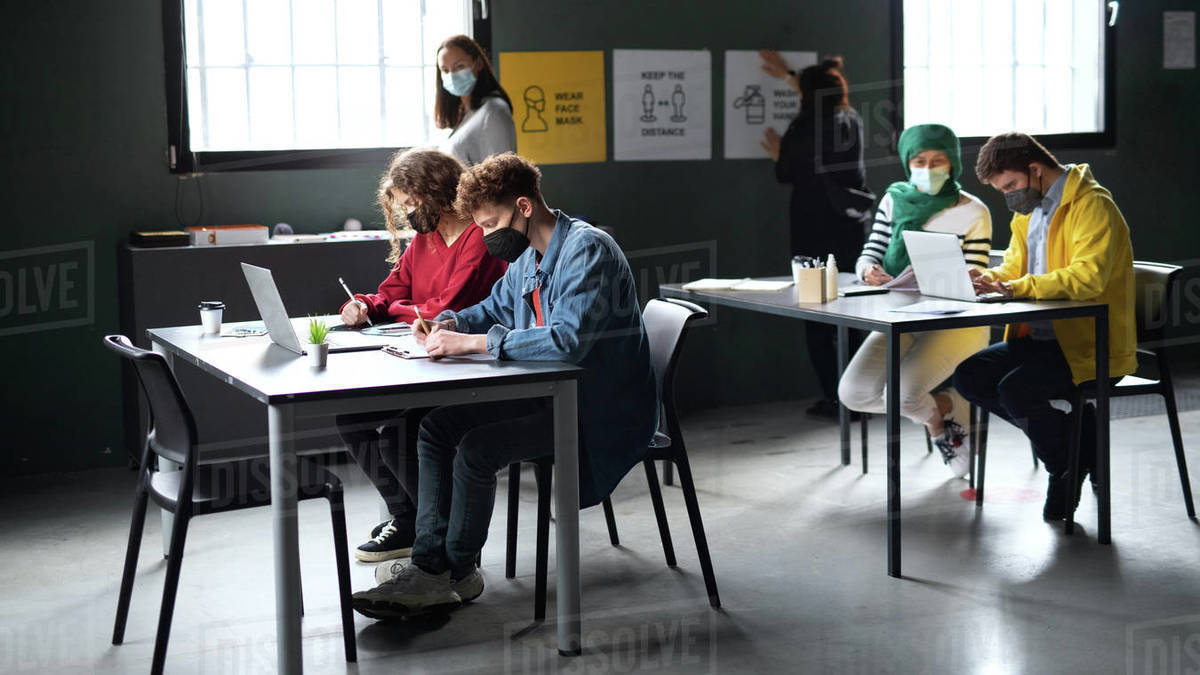 A group of people attending education class in community center ...