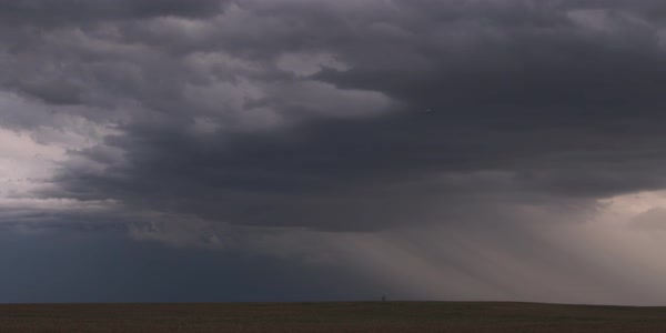 Rain slanting beneath sky-filling elevated thunderstorm sweeping across ...
